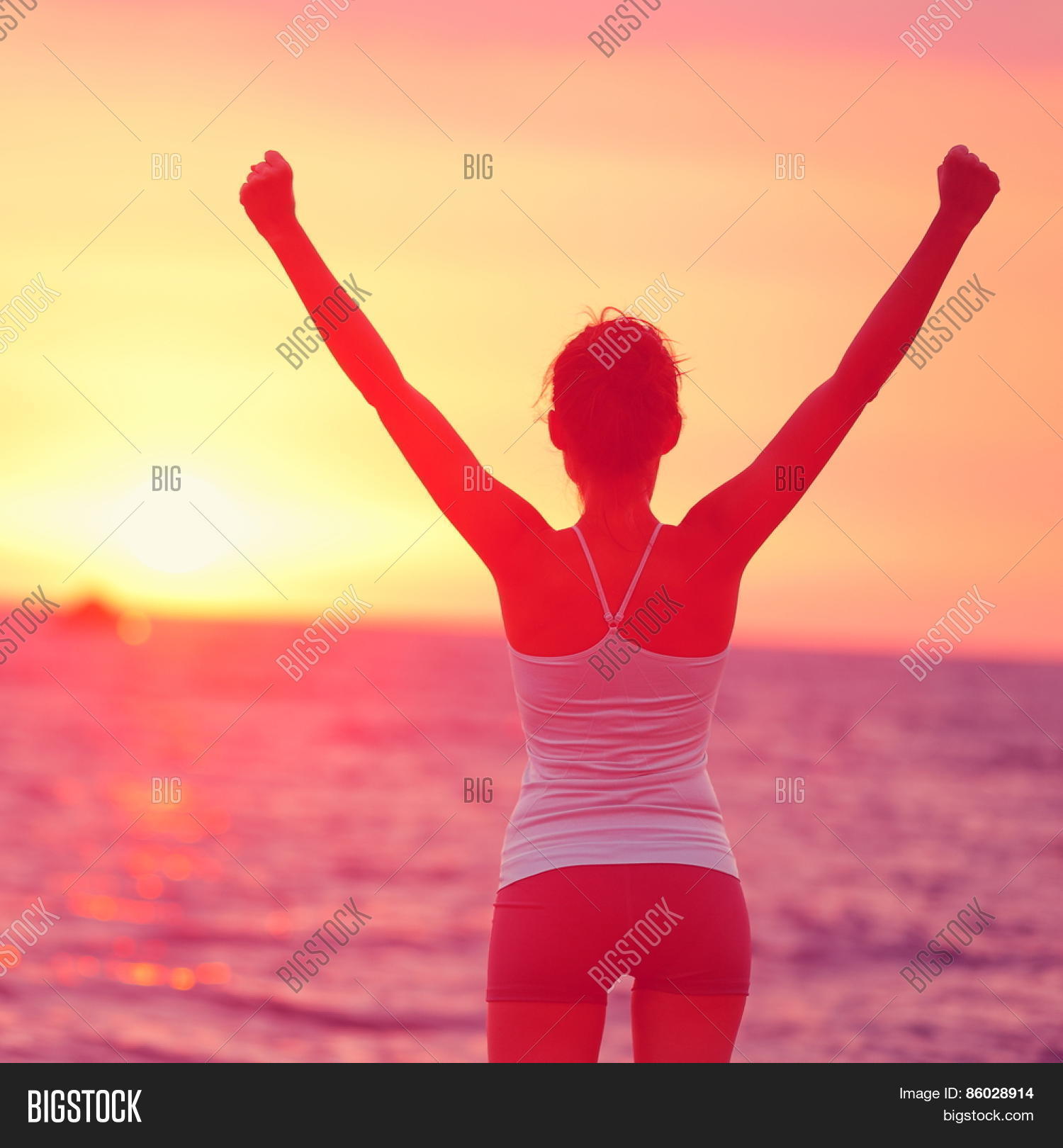 Life achievement - happy woman arms up in success. Back view of female ...