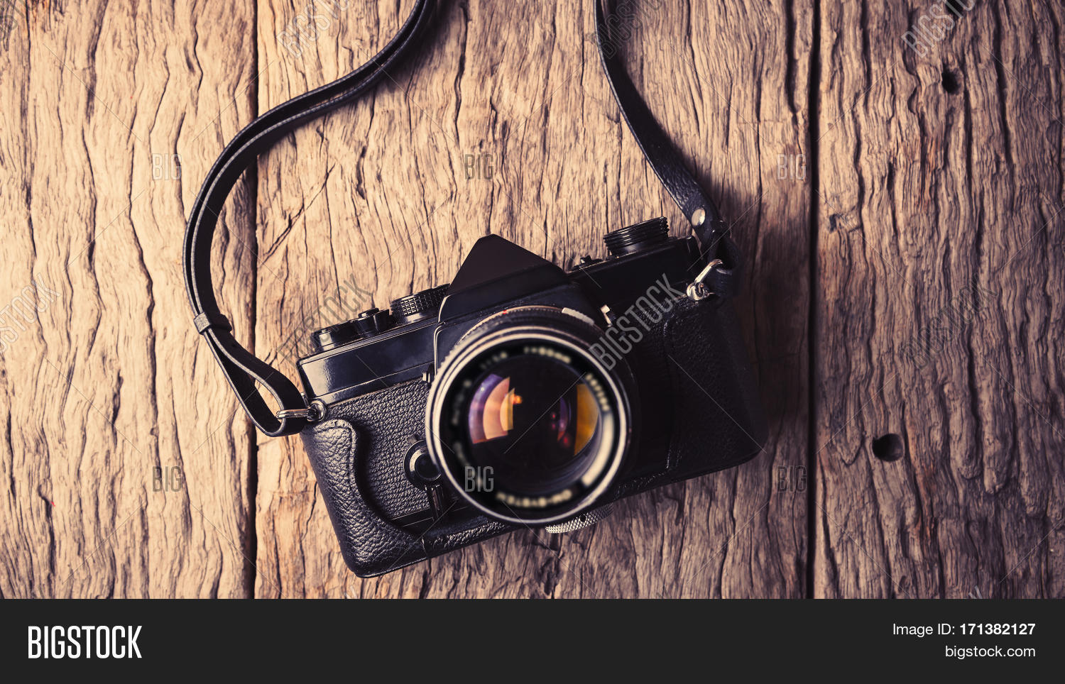 Retro camera on wood table background vintage color tone. Retro camera ...