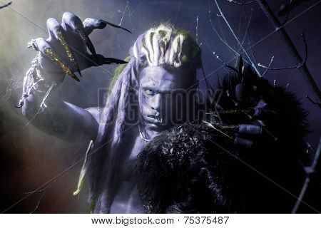 Strong Scary Werewolf With Long Nails In The Wood. Stock Photo & Stock ...